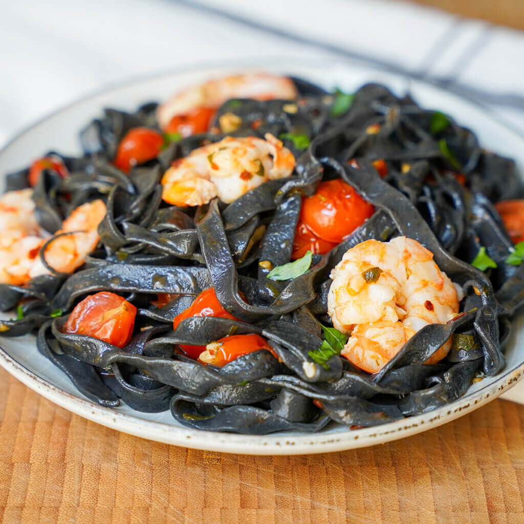 Squid ink pasta with shrimp and tomato - Caroline's Cooking